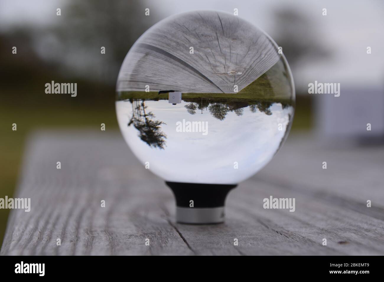 A photograph of an original Lensball Pro 80mm K9 Crystal Ball on a ...