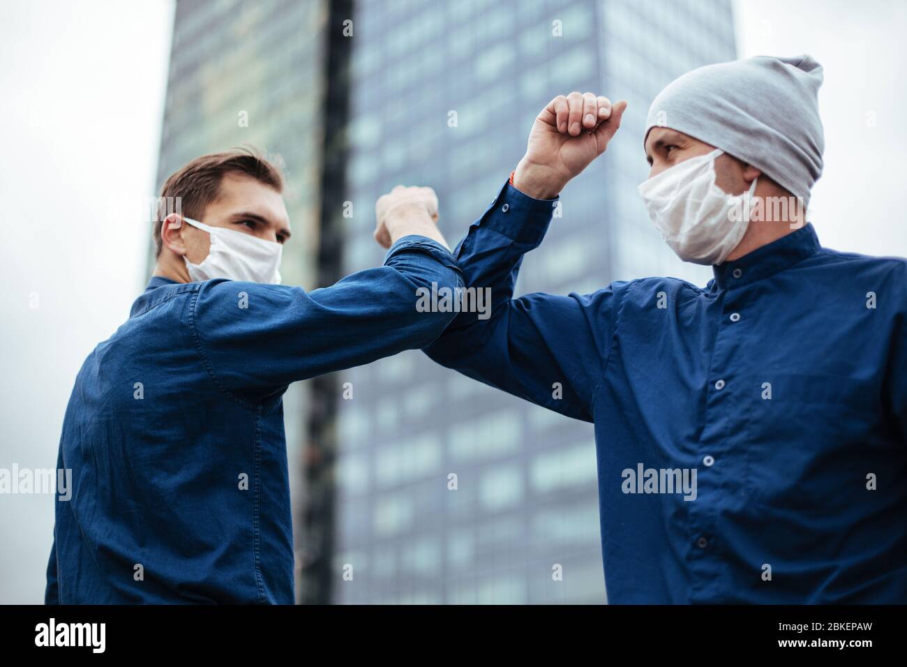 close up. two young men greeting each other with their elbows Stock ...