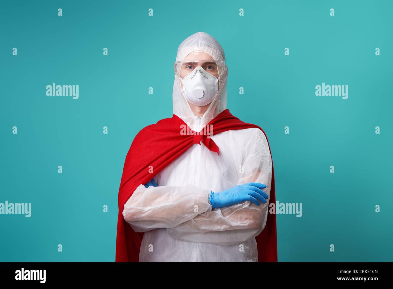 Doctor is wearing PPE - costume, gloves and surgical face mask in ...