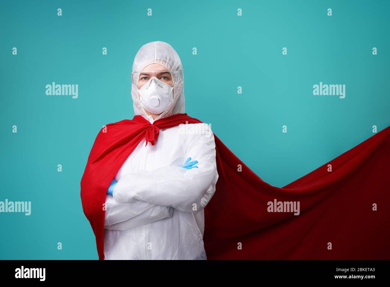 Doctor is wearing PPE - costume, gloves and surgical face mask in ...