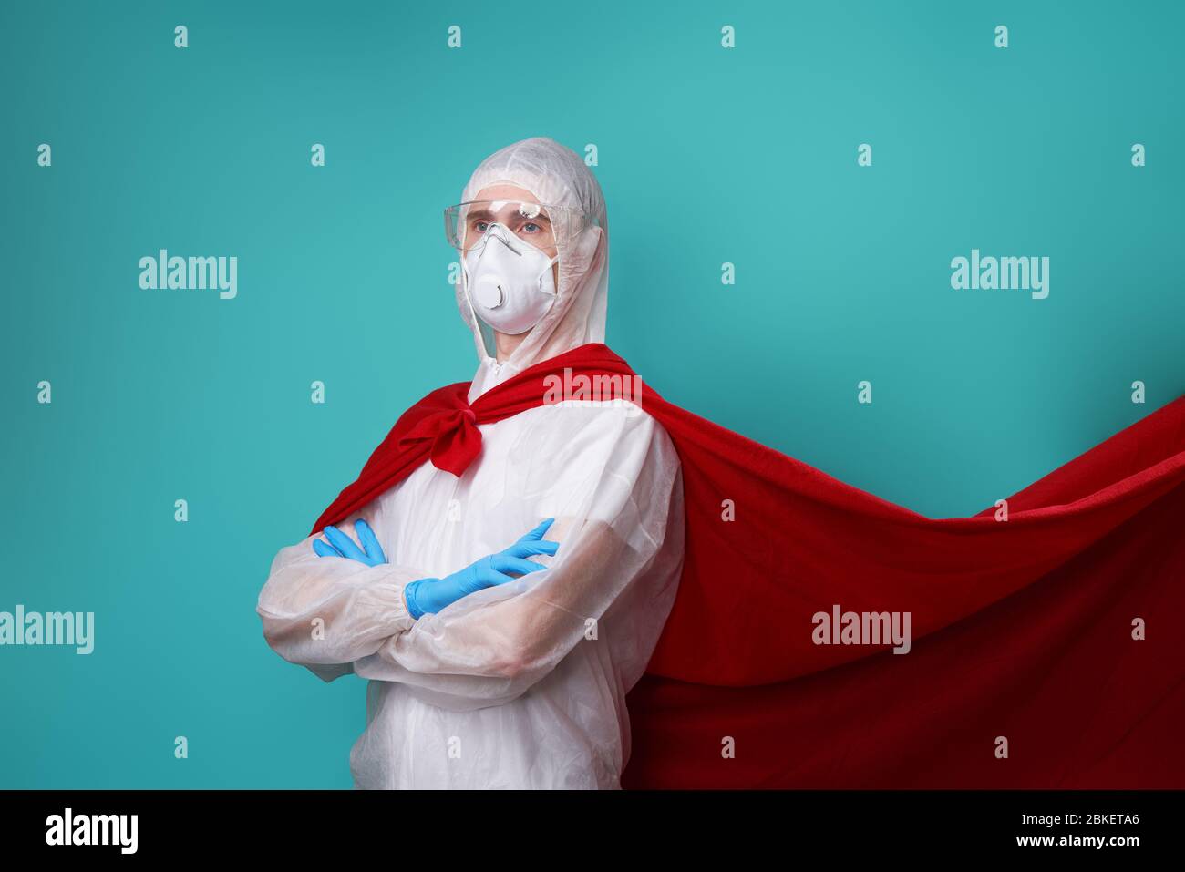 Doctor is wearing PPE - costume, gloves and surgical face mask in ...