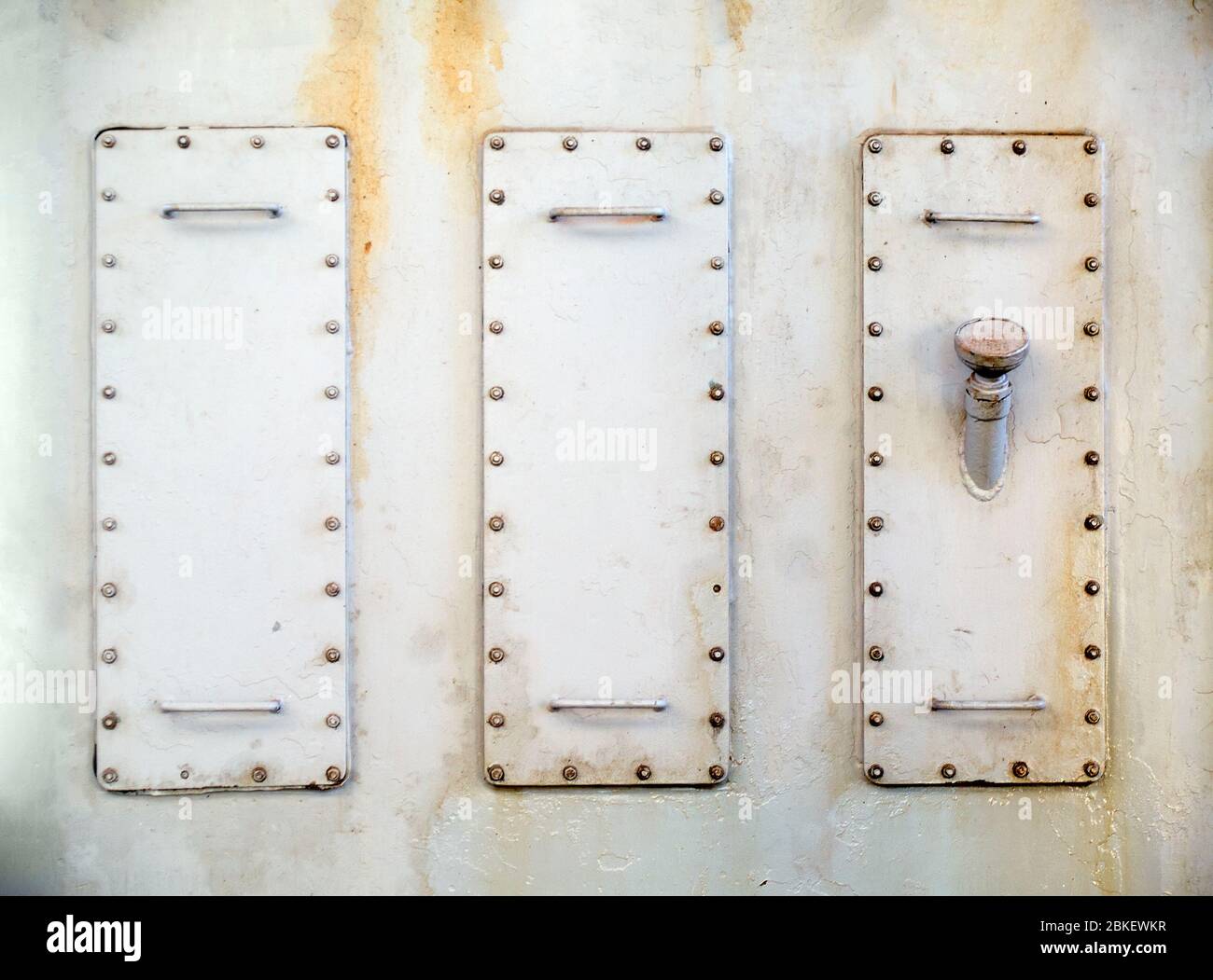 Three metal hatches plate on compressor for revision close-up with ...