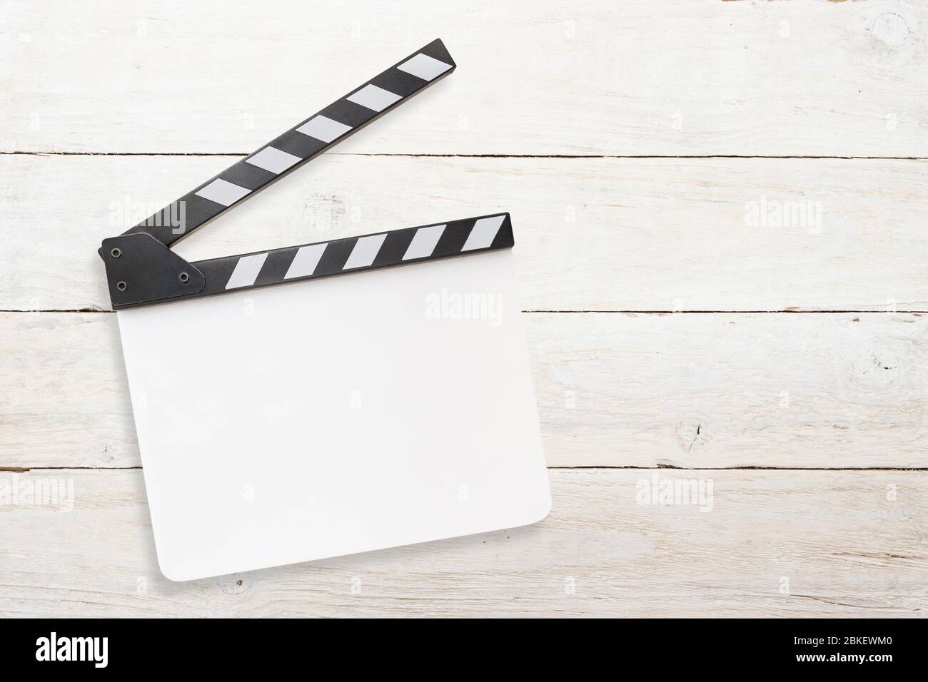 Blank white clapper board on white wooden background Stock Photo - Alamy