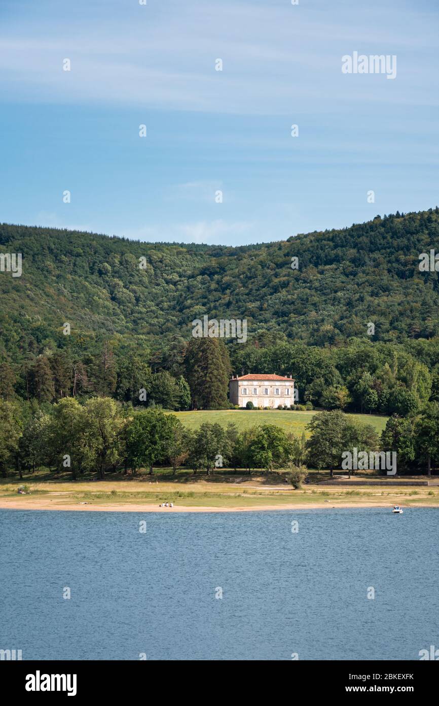 Beautiful French manor house sits with a spectacular view over a lake ...