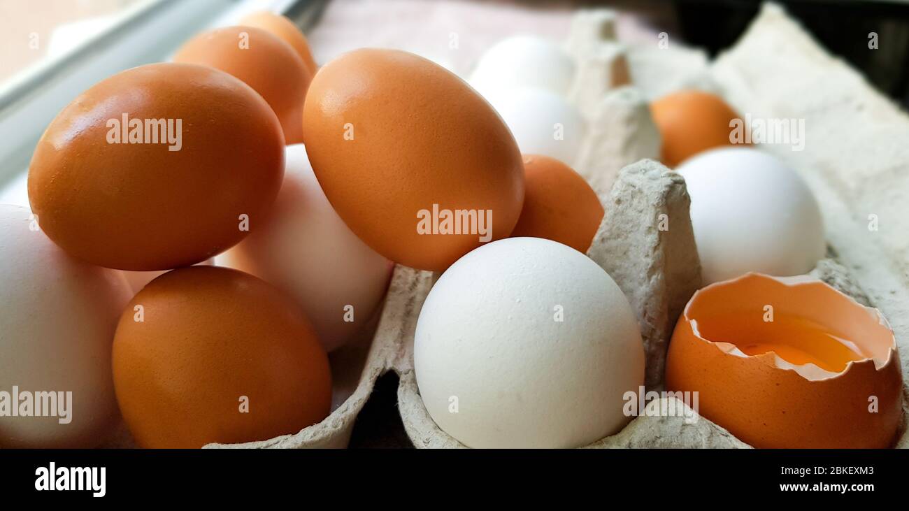 Many white and brown eggs are randomly laid Stock Photo - Alamy