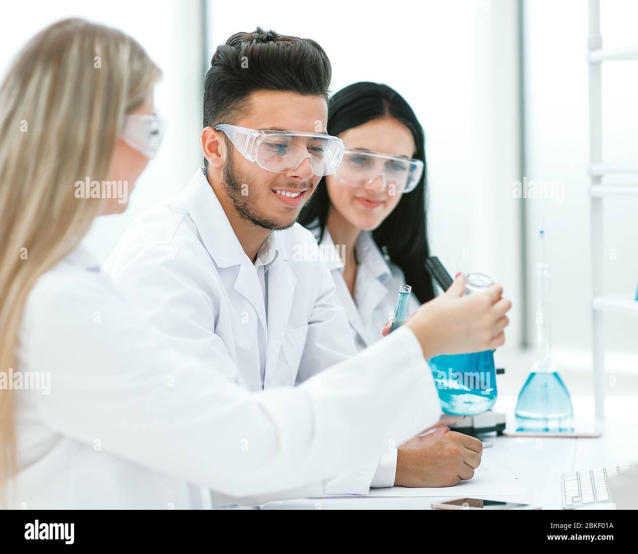 close up.a team of scientists sitting at the laboratory table Stock ...
