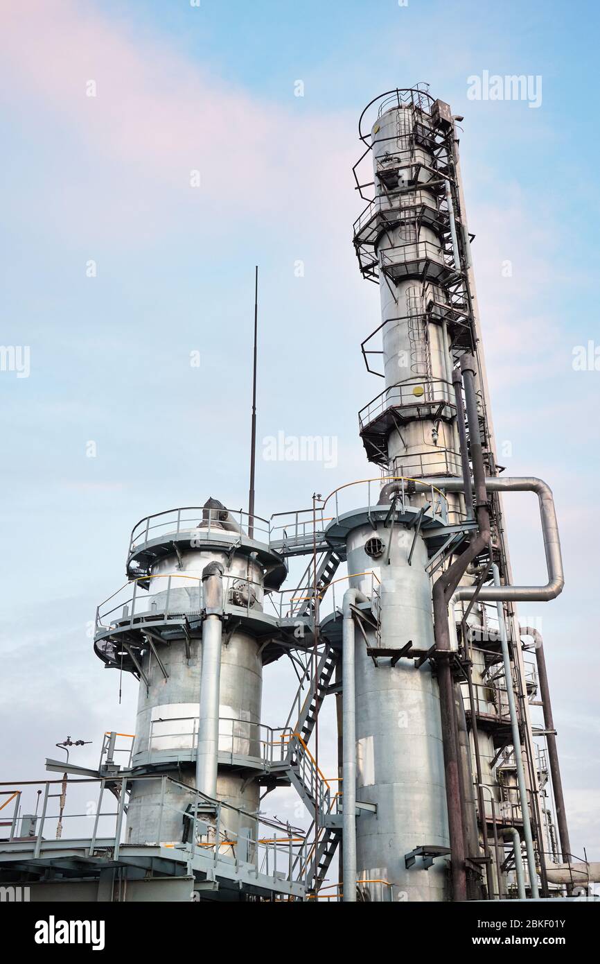 Oil refinery chemical plant vertical bottom view, with copy space over ...
