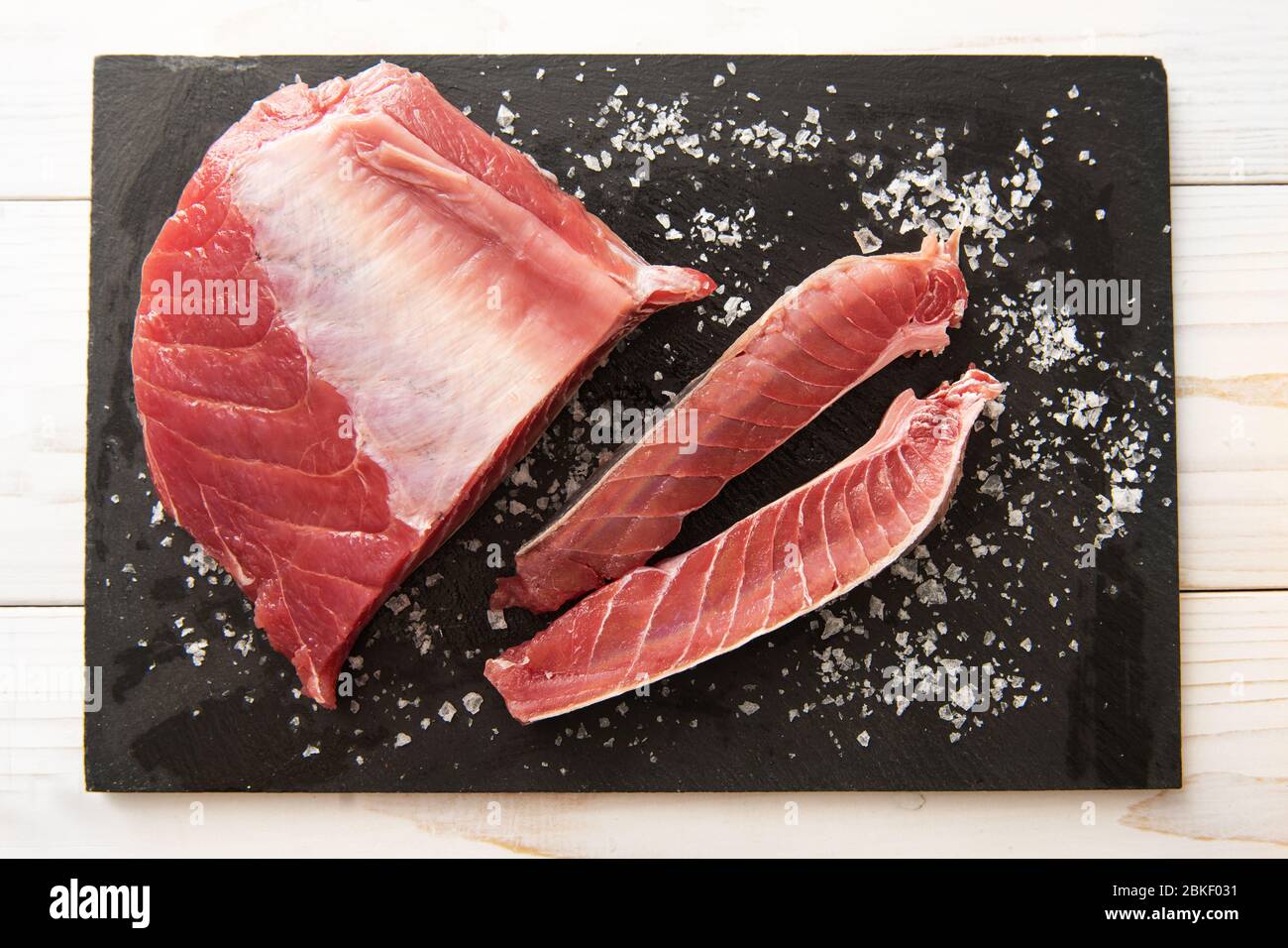 Fresh large piece of tuna with salt Stock Photo - Alamy