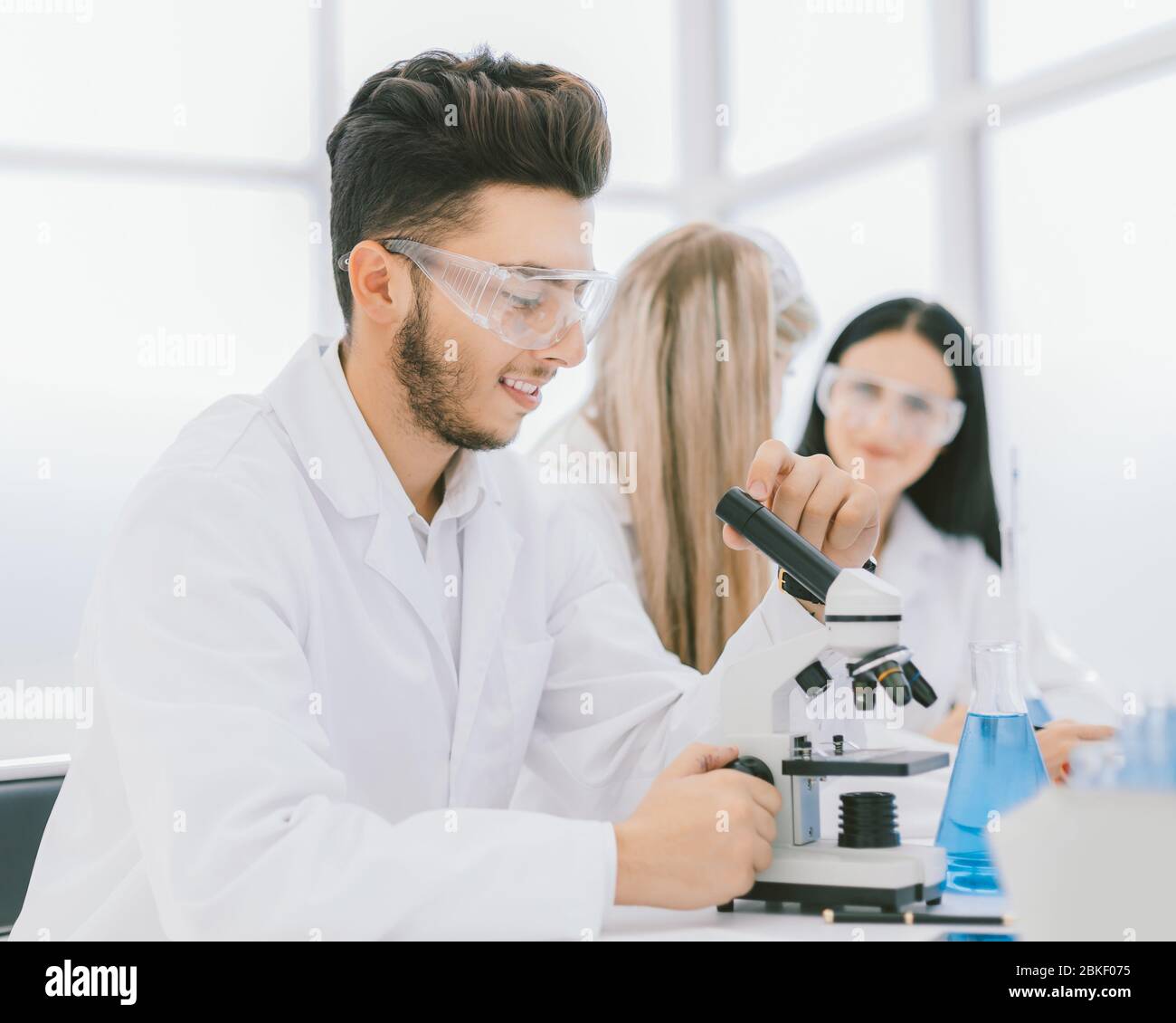 scientists biologists sitting at the laboratory table Stock Photo - Alamy