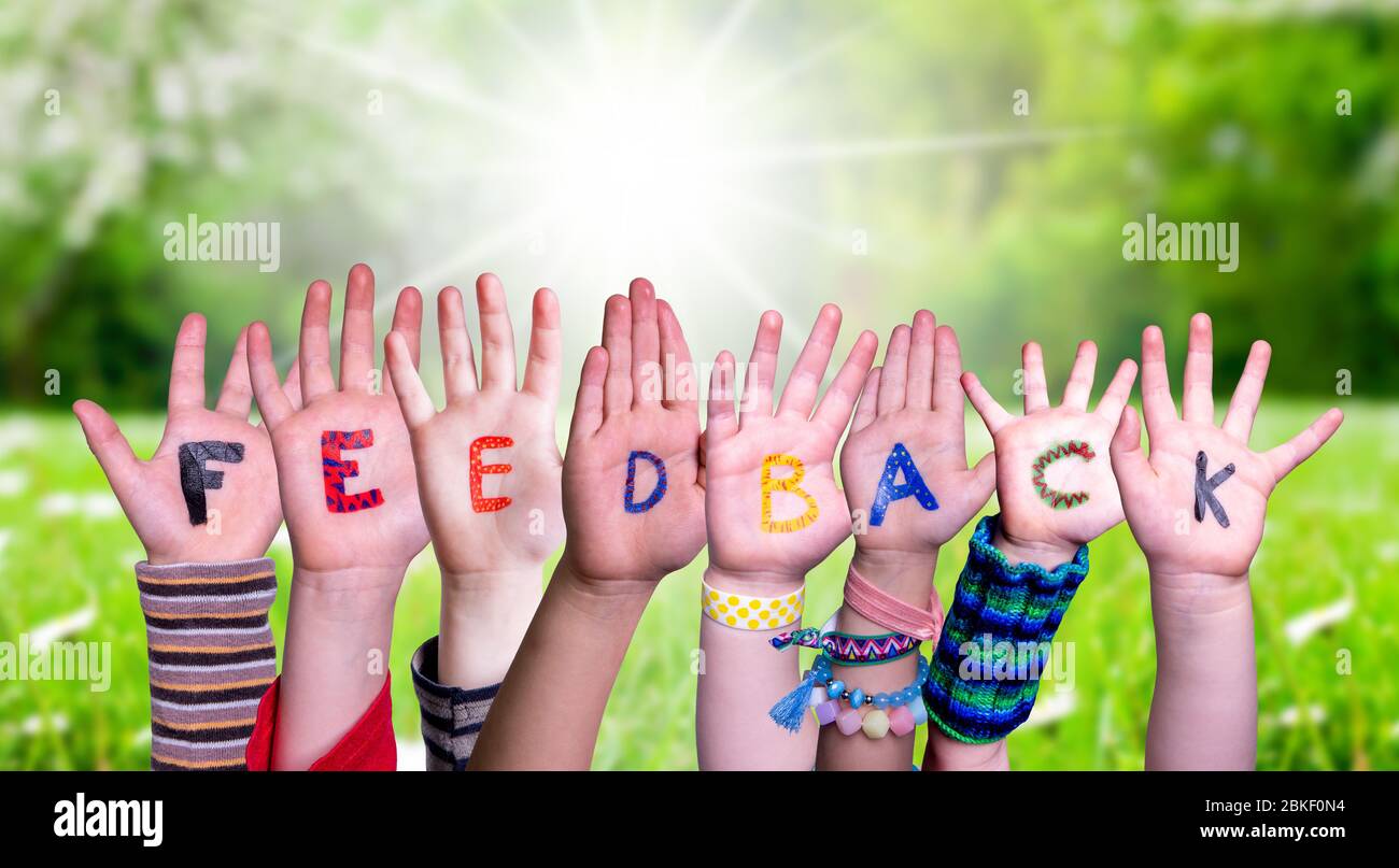 Children Hands Building Word Feedback, Grass Meadow Stock Photo - Alamy