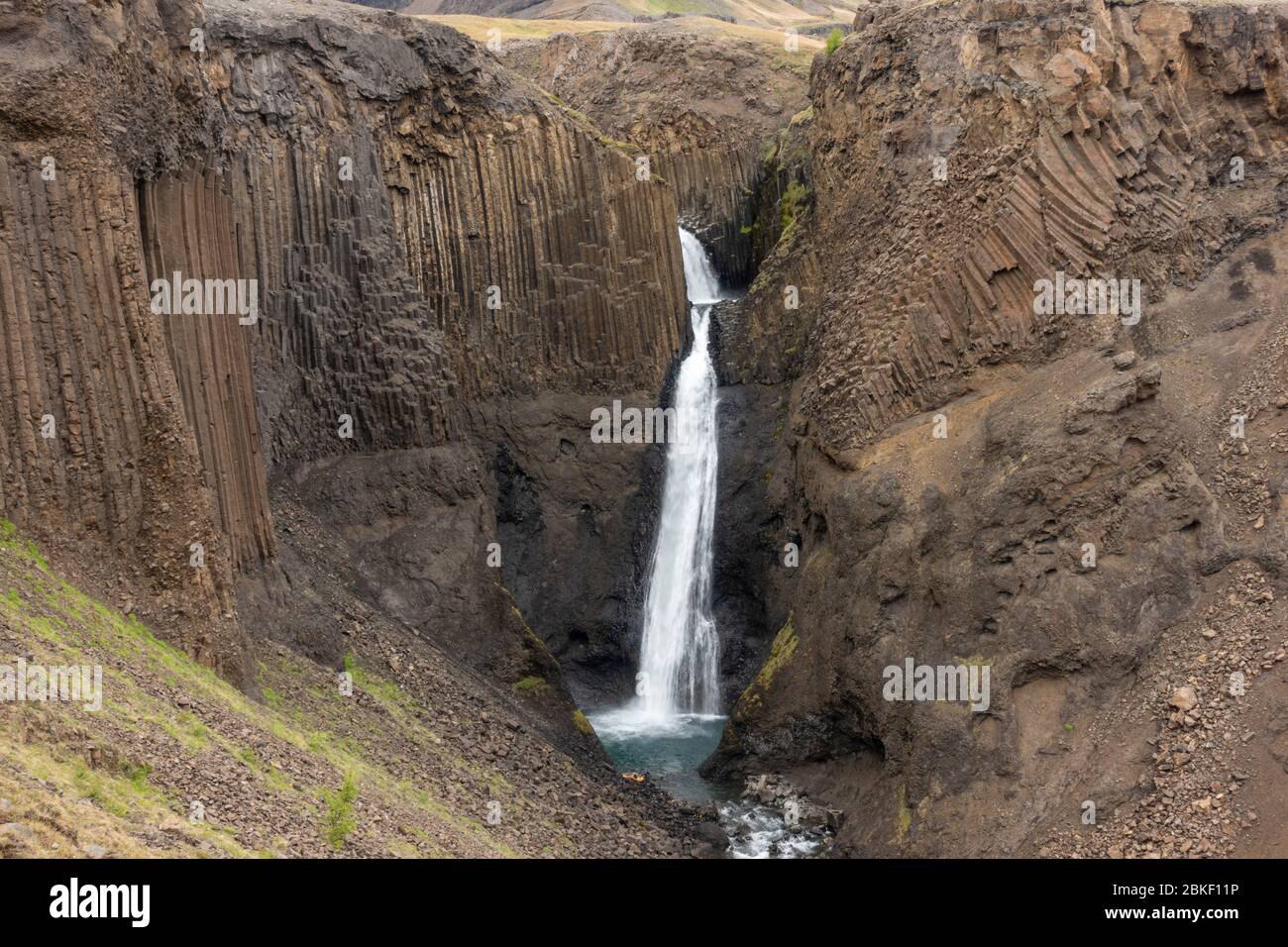 The stunning Litlanesfoss waterfall where the water falls between ...