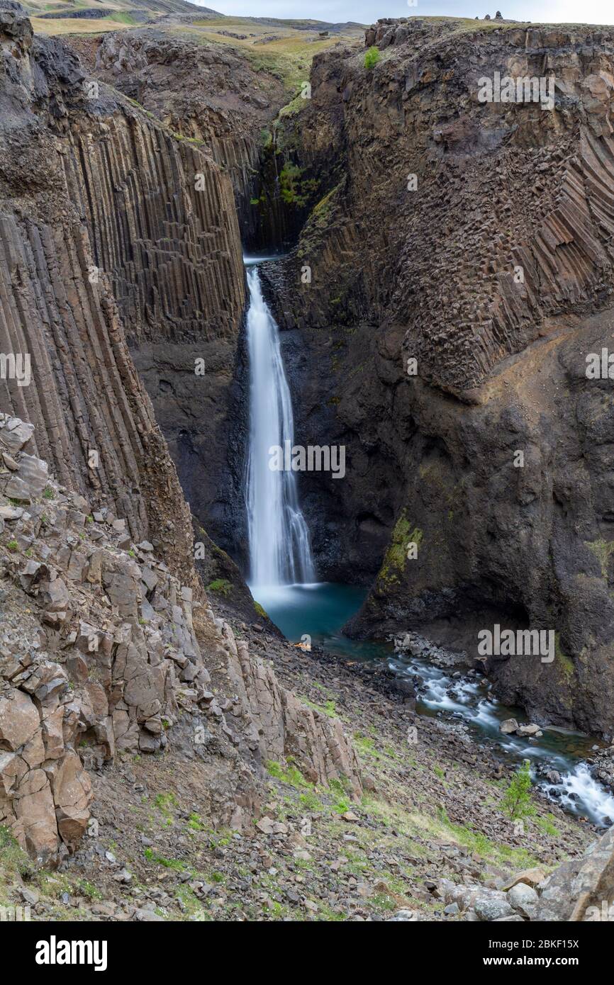 Long exposure of the stunning Litlanesfoss waterfall where the water ...