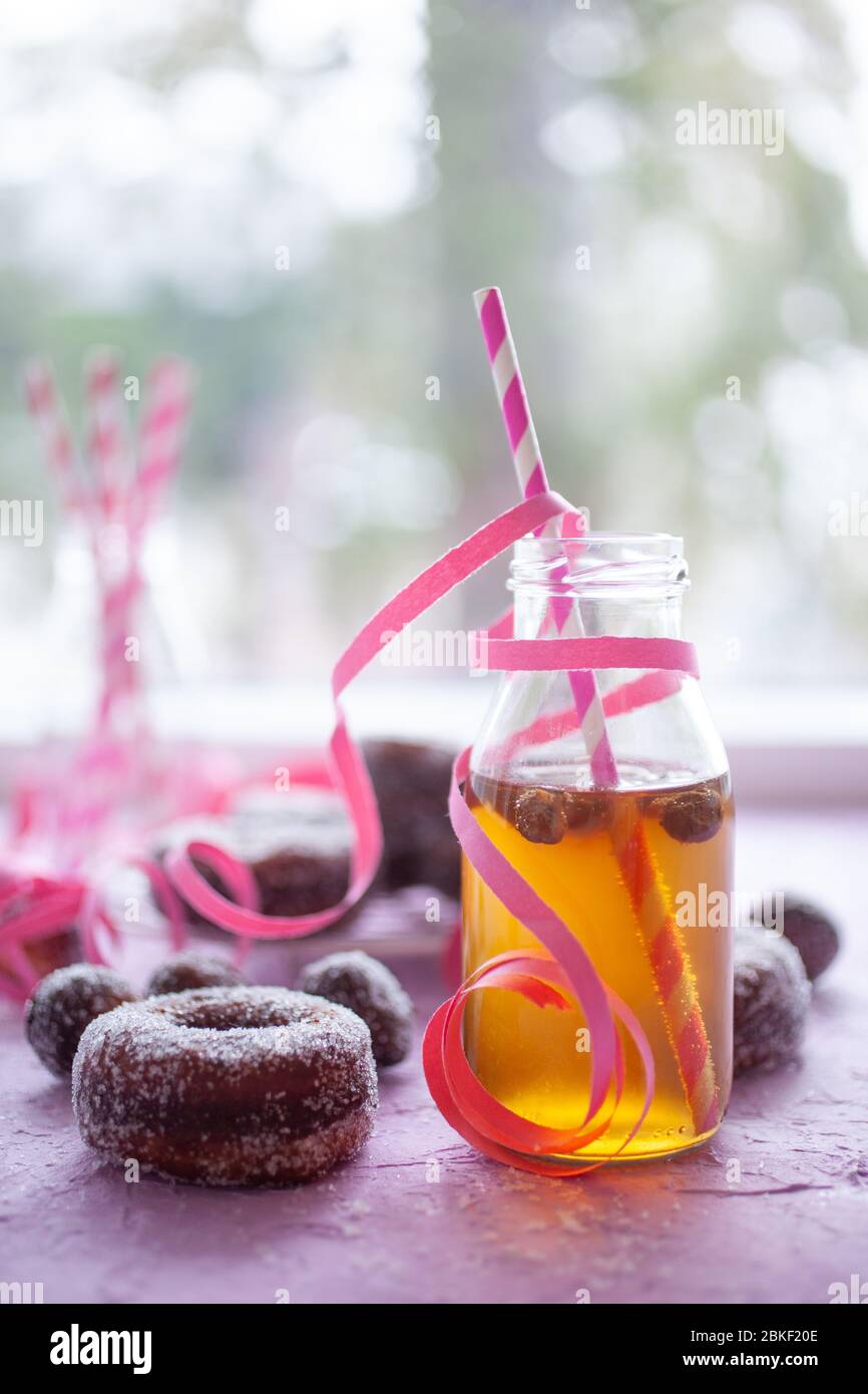 Sugar donuts and traditional finnish drink sima Stock Photo - Alamy