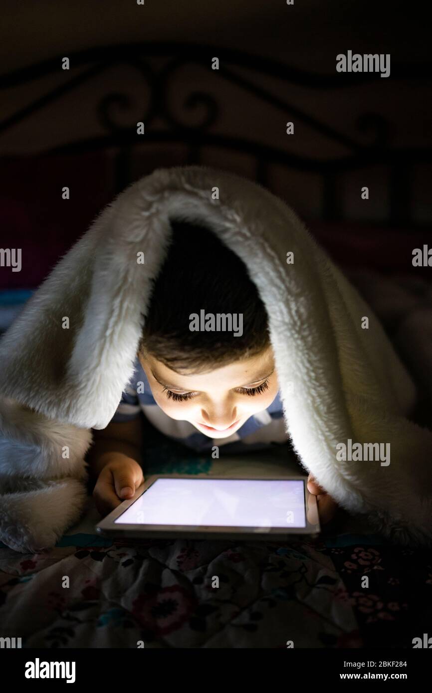 Child tablet night eyes hi-res stock photography and images - Alamy