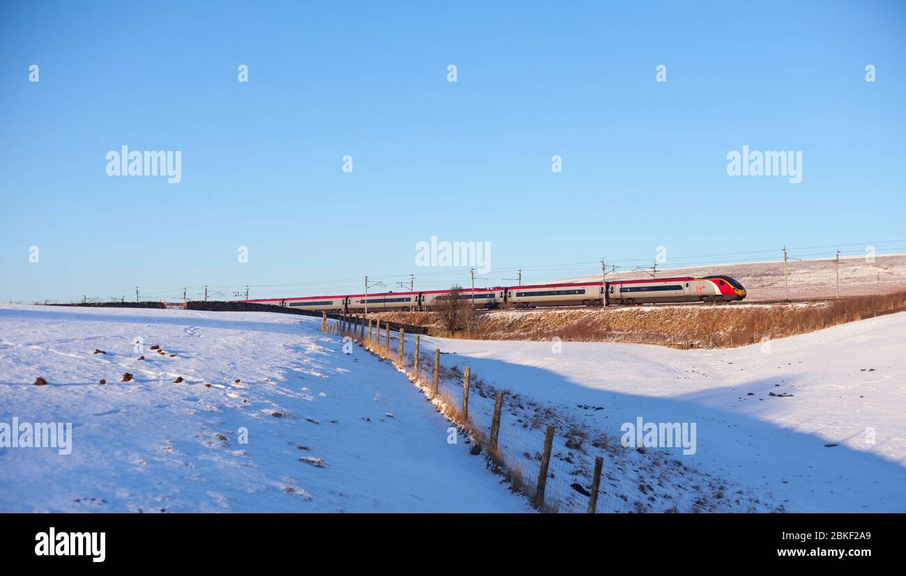 Virgin trains Alstom class 390 Pendolino train passing Shap wells on ...