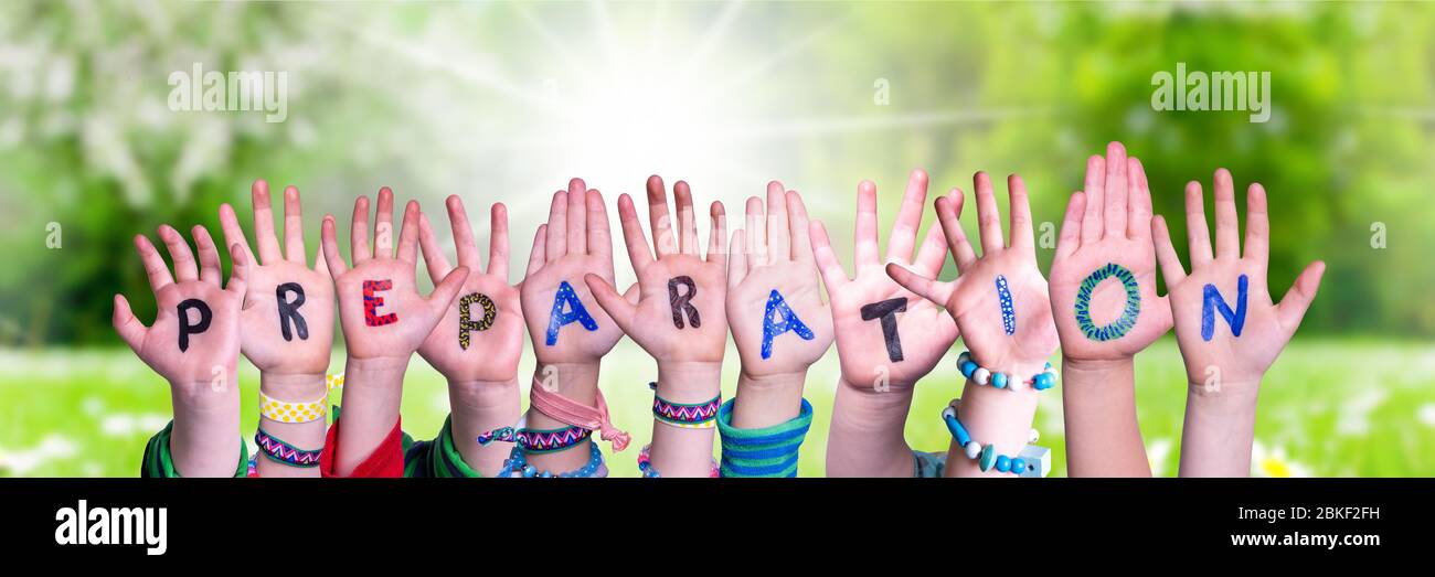 Kids Hands Holding Word Preparation, Grass Meadow Stock Photo - Alamy