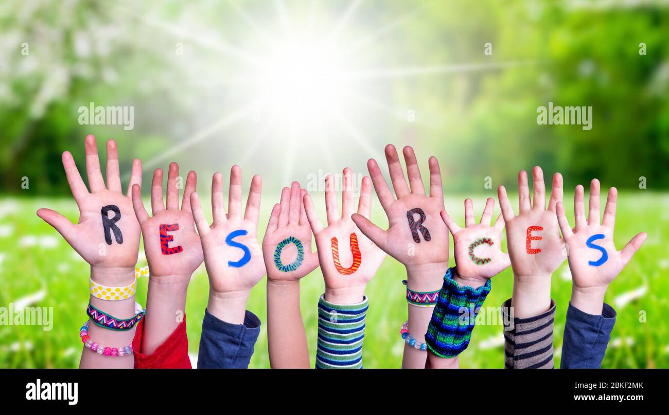 Children Hands Building Word Resources, Grass Meadow Stock Photo - Alamy