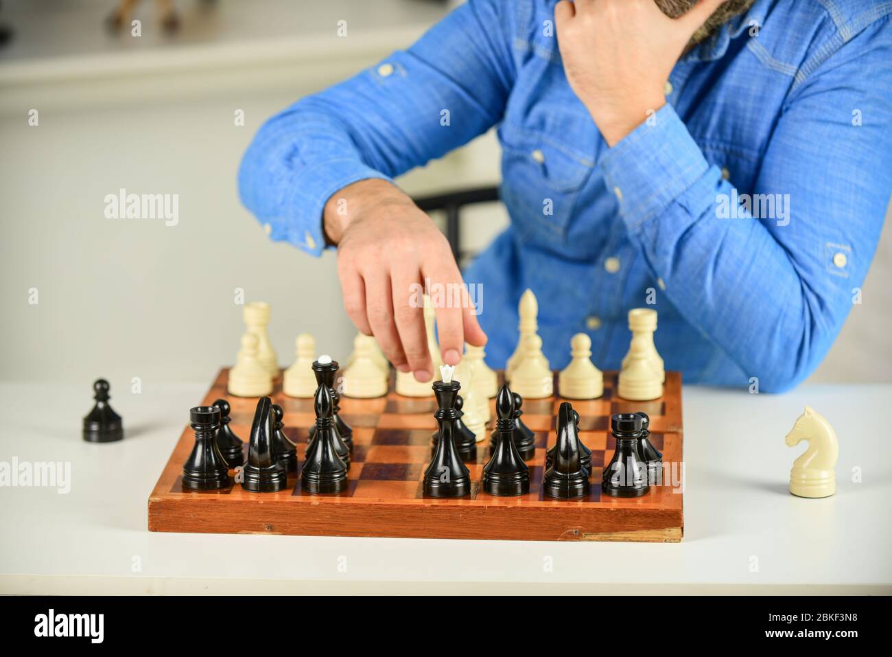Playing chess. Intellectual hobby. Figures on wooden chess board ...