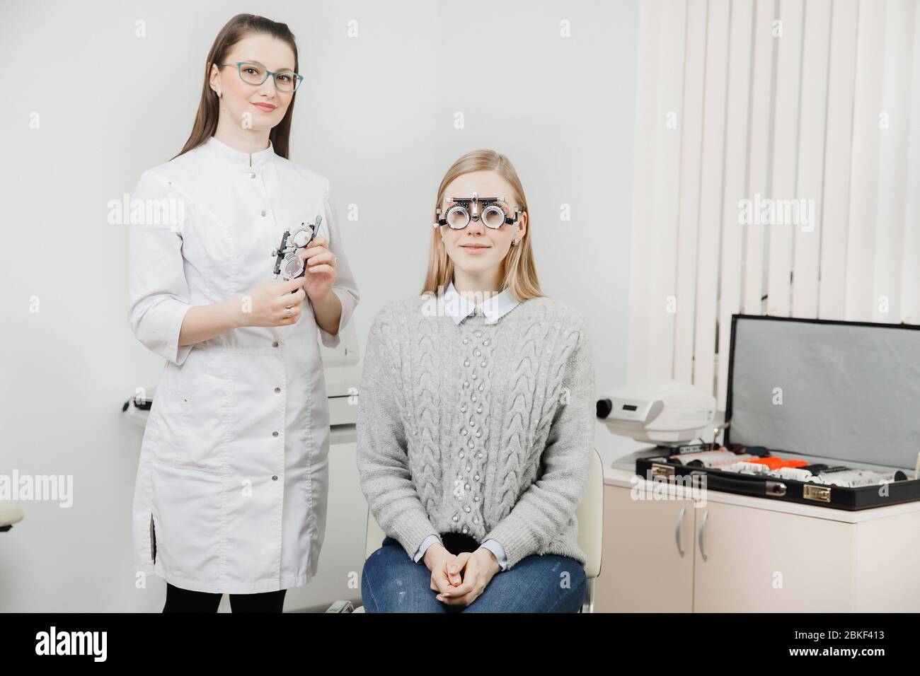Ophthalmologist woman doctor checks diagnose eyesight myopia, hyperopia ...