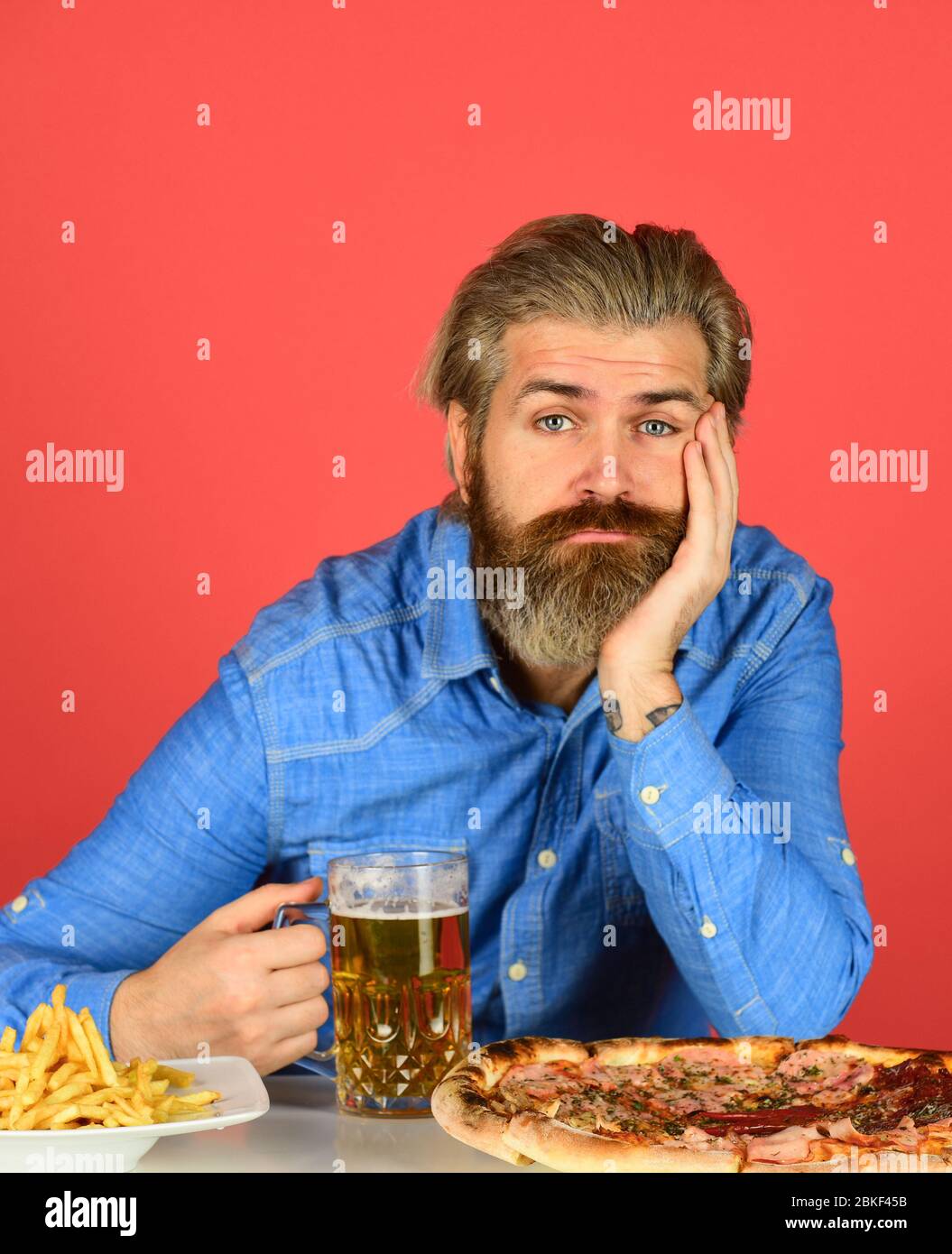 american fast food. bearded man with beer and pizza. italian food ...