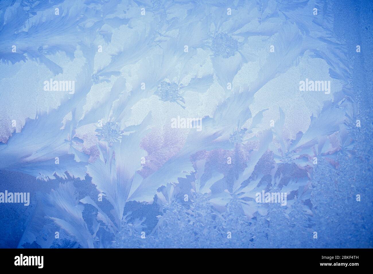 Frost drawing on window glass, snowflake ornament after anomaly ice ...