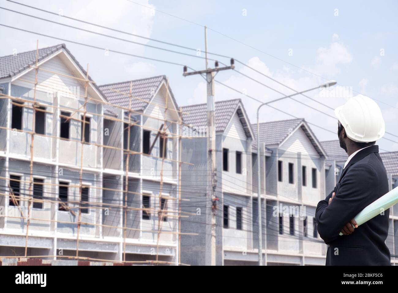 African engineering man with the building construction Stock Photo - Alamy