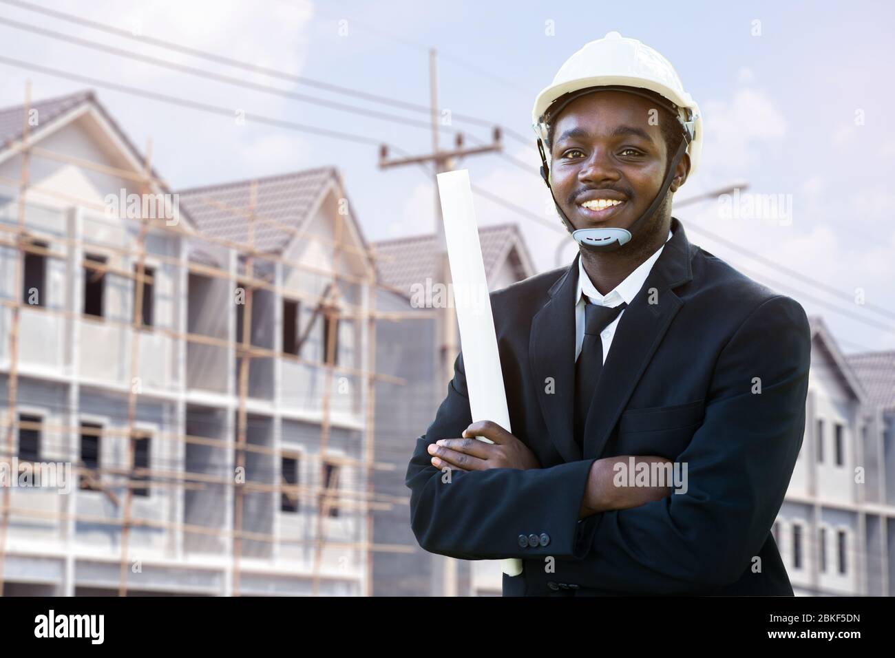 Portrait of smile african industrial engineer manager standing with the ...