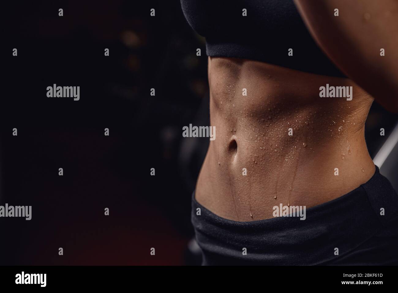 Inflated body fitness of young woman, abdominal muscles dices. Concept ...