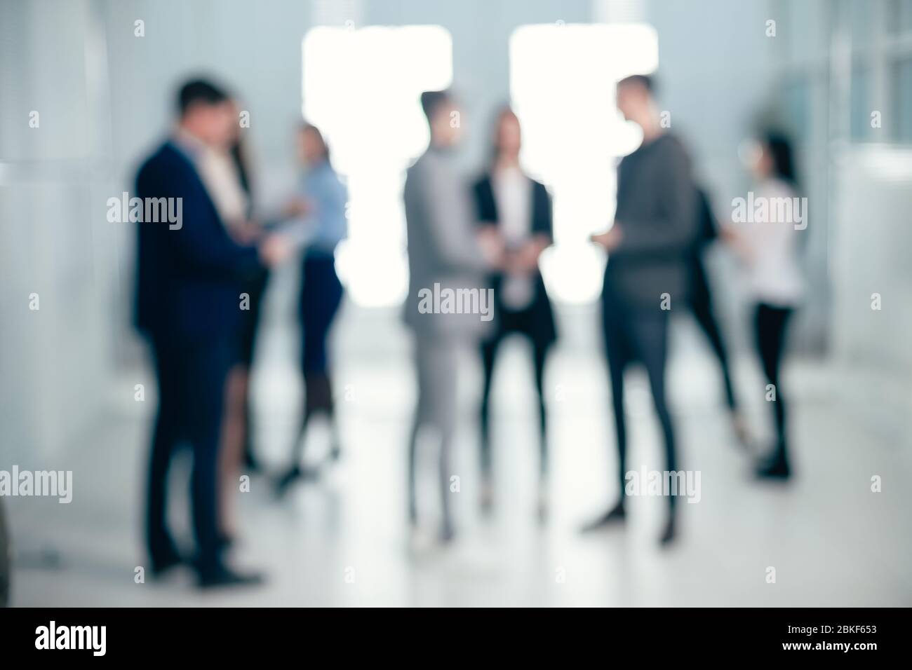 background image of a group of corporate employees in the office lobby ...