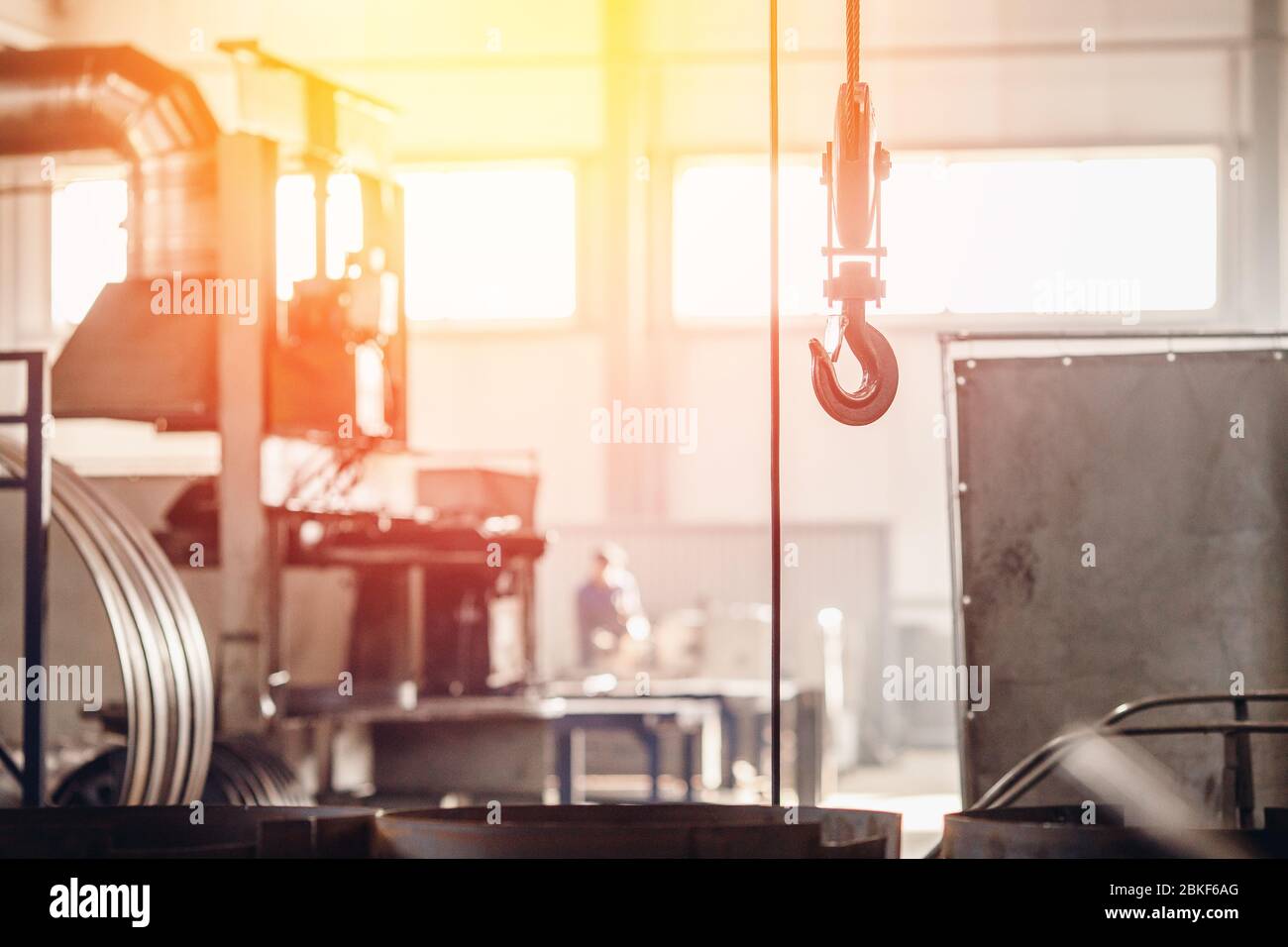Crane chain and hook with blurred warehouse background. Concept ...