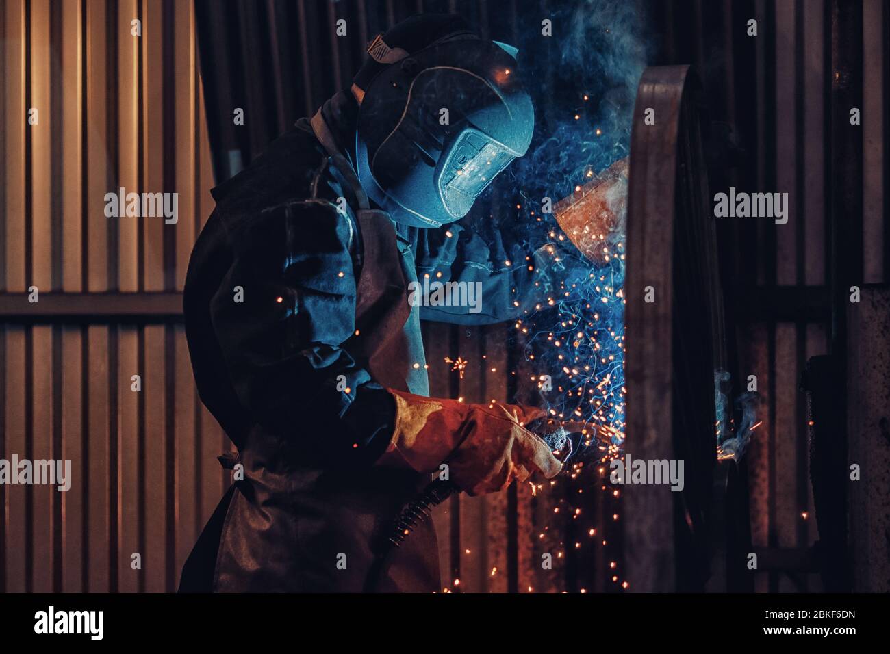 Professional welder performs welding hi-res stock photography and ...