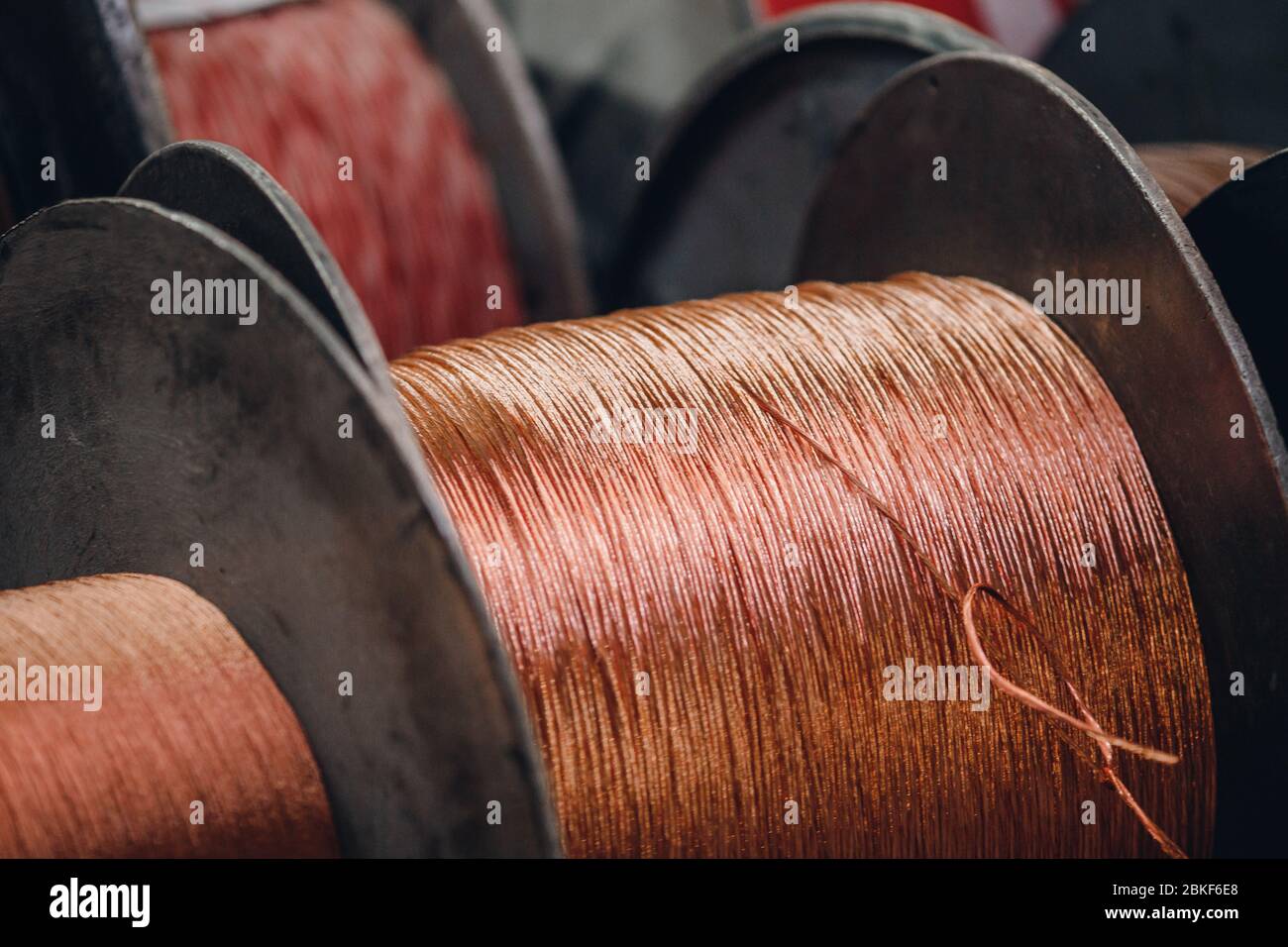 Production of copper wire, bronze cable in reels at factory Stock Photo ...