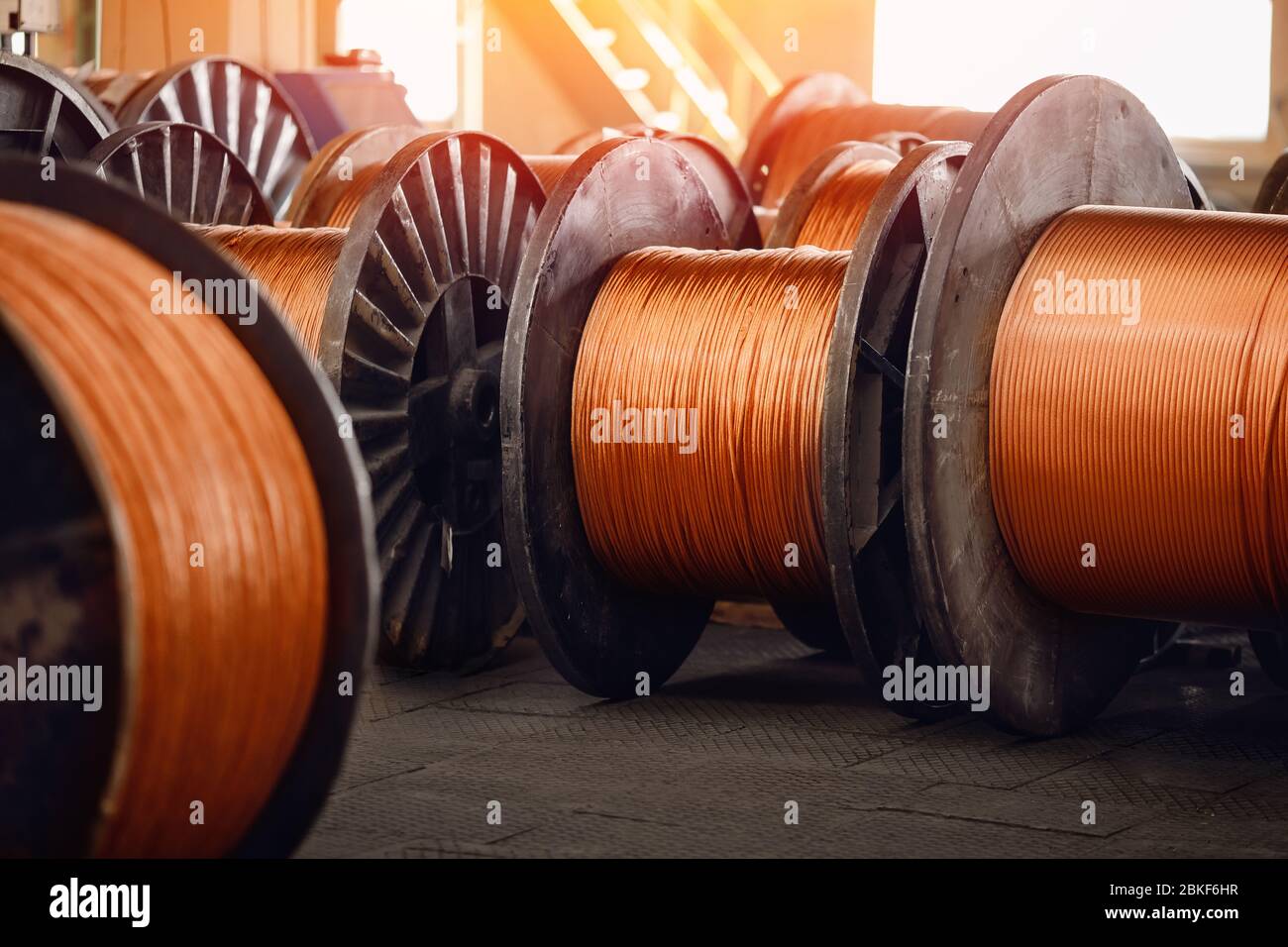 Production of copper wire, bronze cable in reels at factory Stock Photo ...