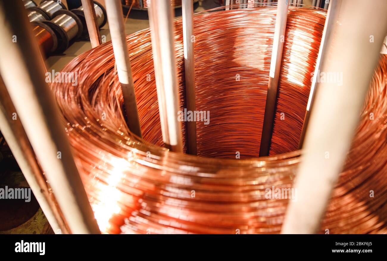 Production of copper wire, bronze cable in reels at factory Stock Photo ...