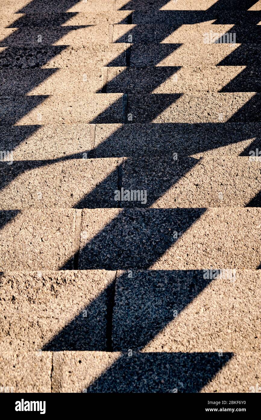 Abstract background shot with a pattern created by harsh shadows on a ...