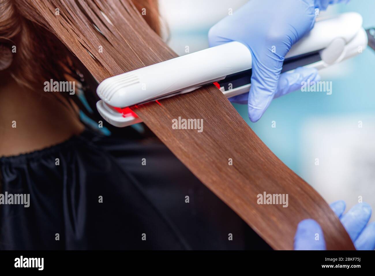 Procedure Of Keratin Hair Straightening And Restoration Saturation