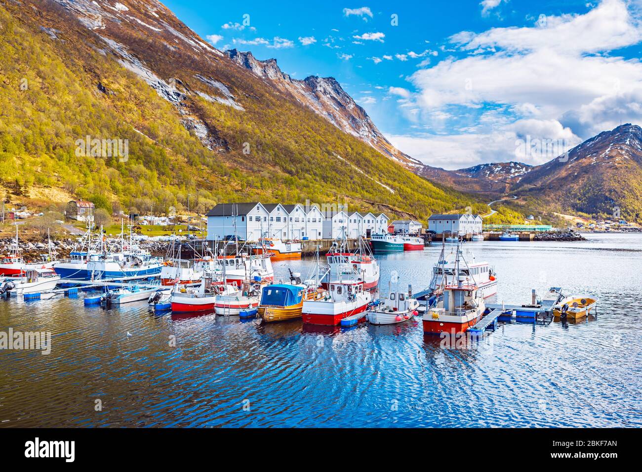 The port of Husoy village on Senja Island beyond the Polar Circle in ...