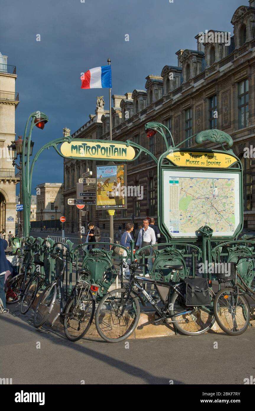 Art Deco Metro Entrance by the Louvre, Paris, France with bicycles ...