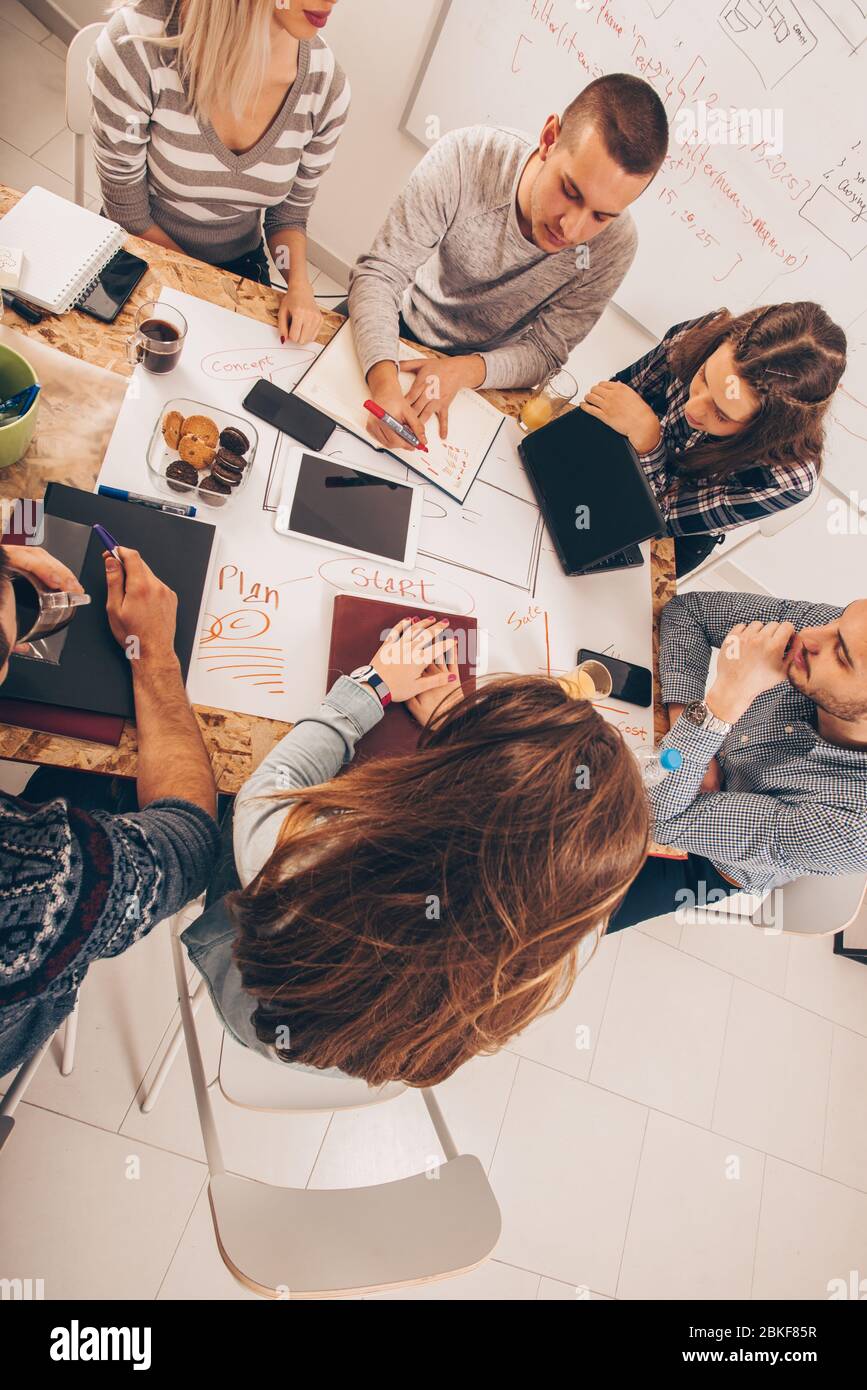 A group of well educated people are having a business meeting in the ...