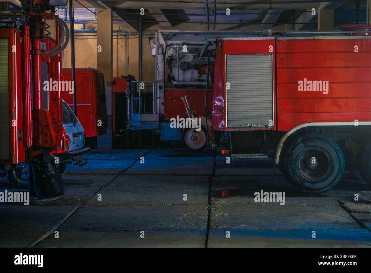 Fire engine inside the garage of the fire department Stock Photo - Alamy