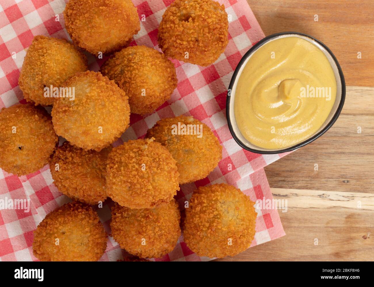 Dutch traditional snack bitterbal on a serving board, isolated Stock ...