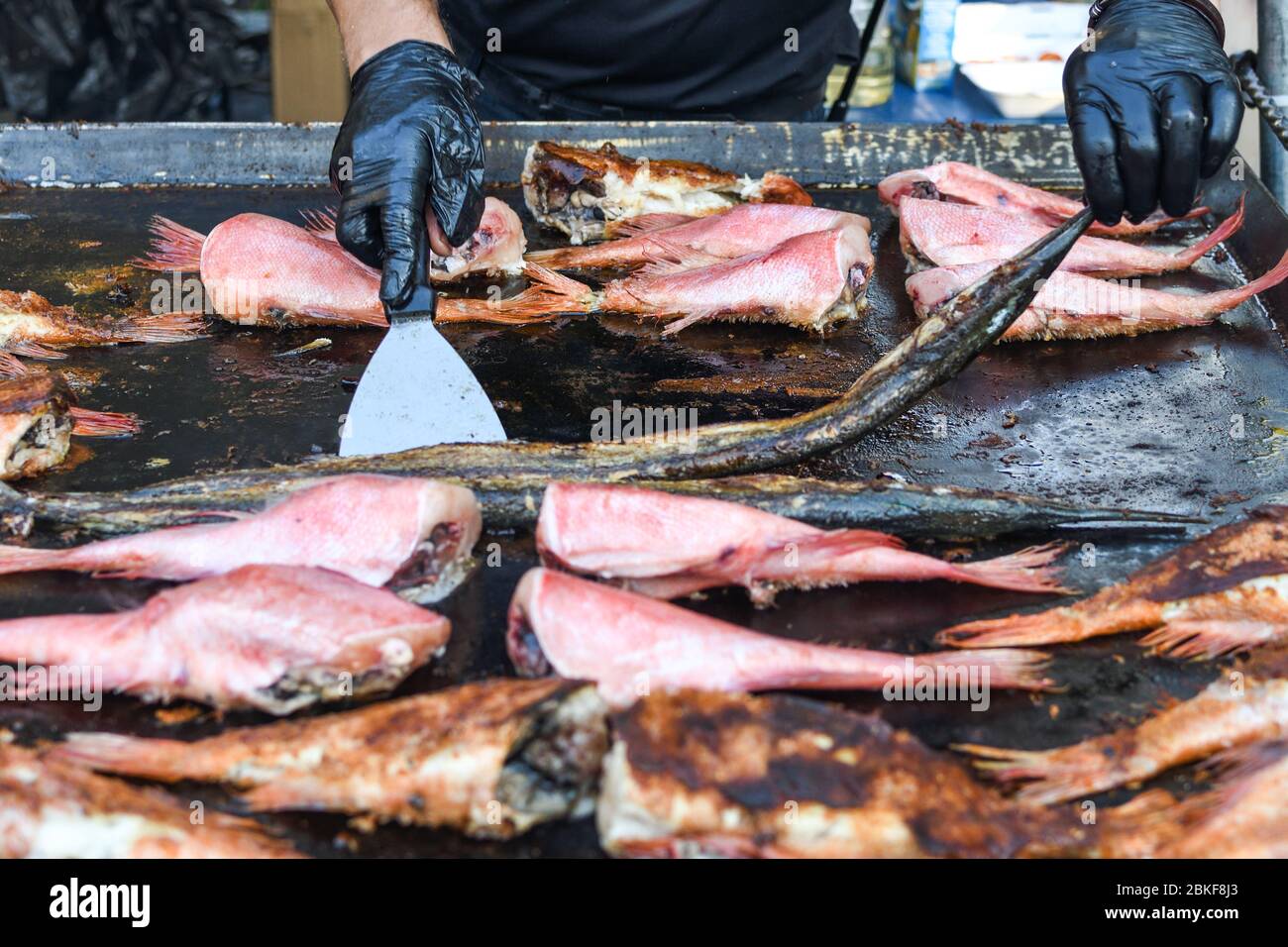 Fresh raw fish on grill slate, during seafood festival, street food ...