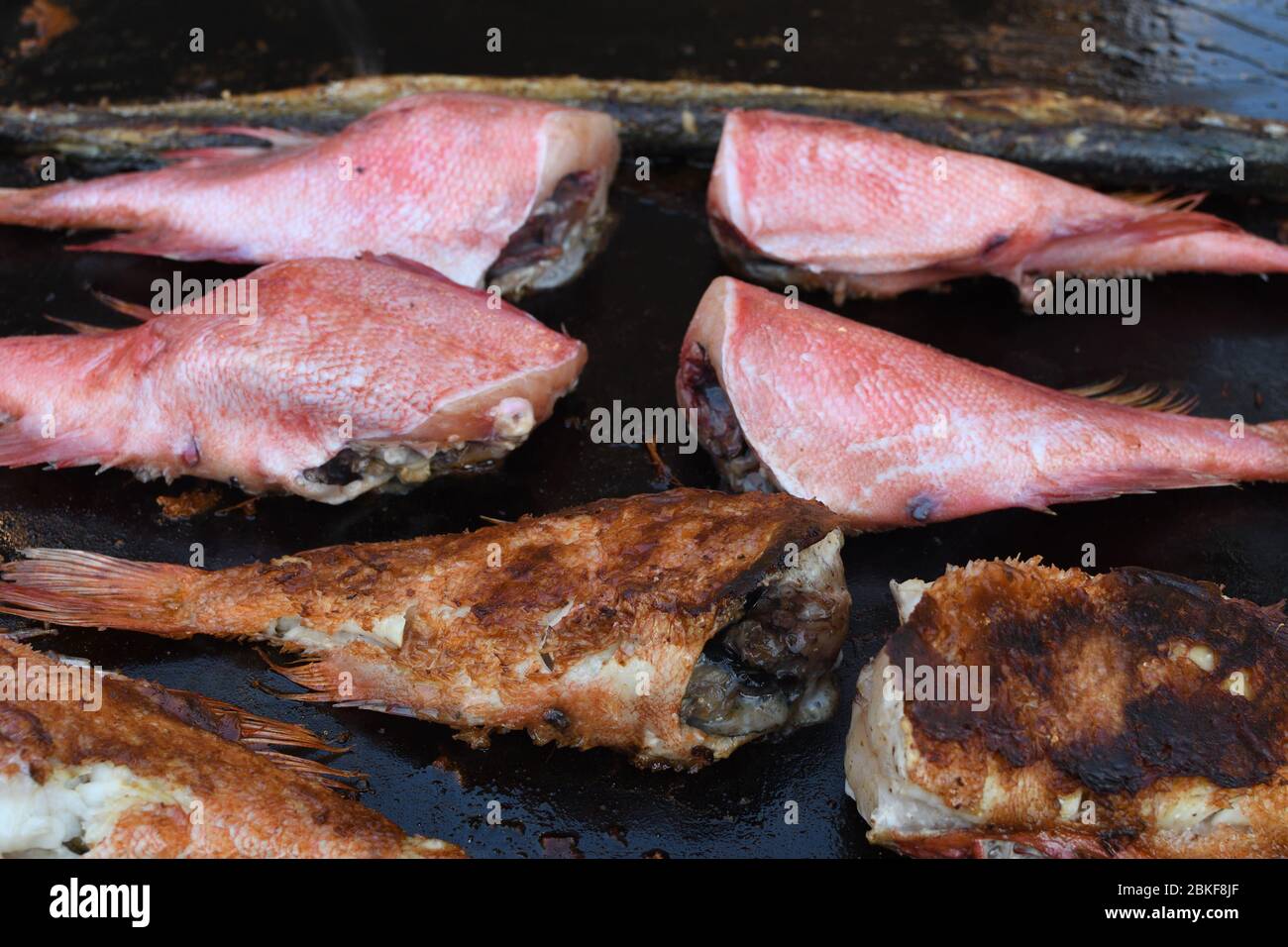 Fresh raw fish on grill slate, during seafood festival, street food ...