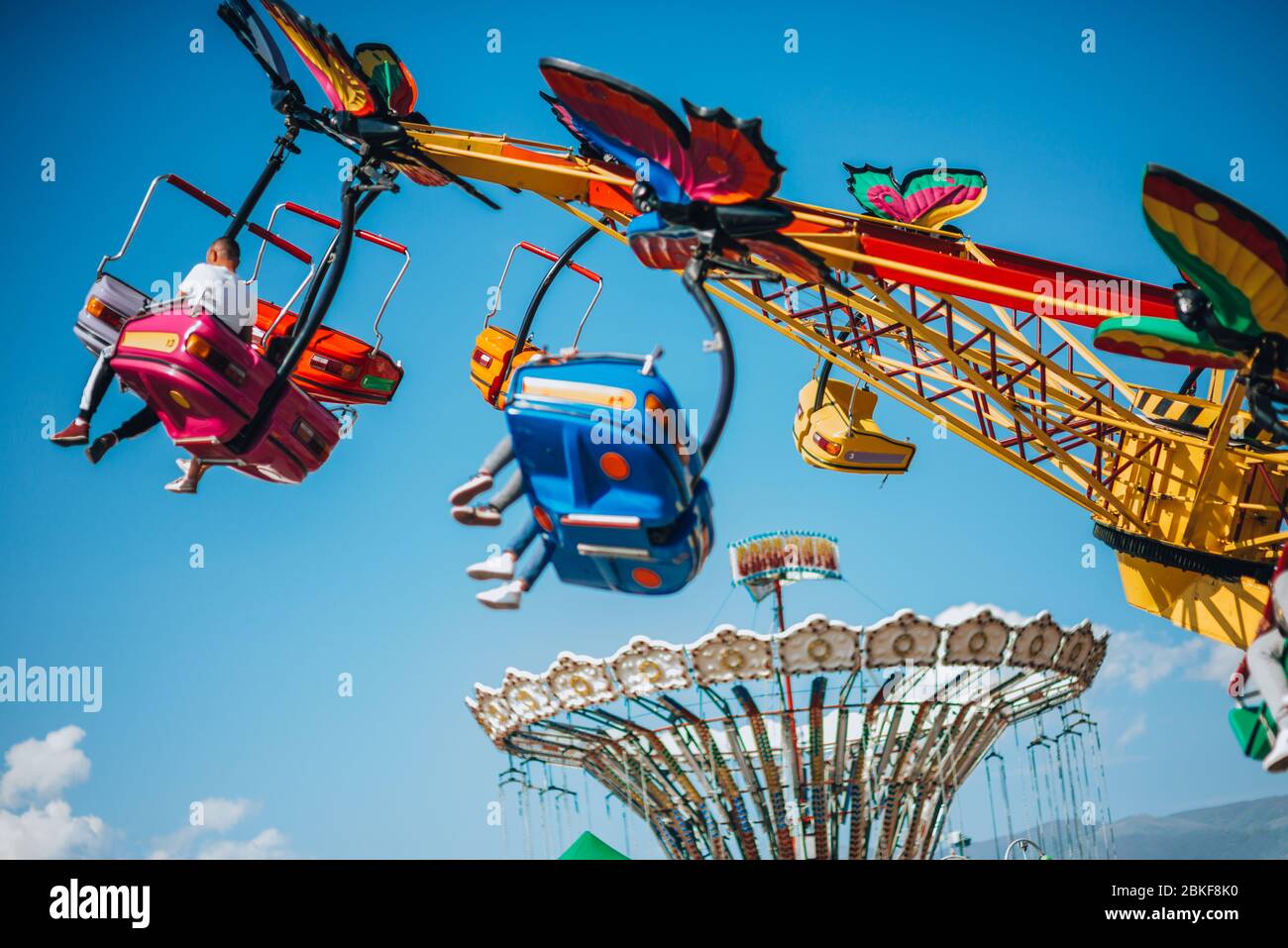 Colorful rotating chair swing ride at the local amusement park Stock ...