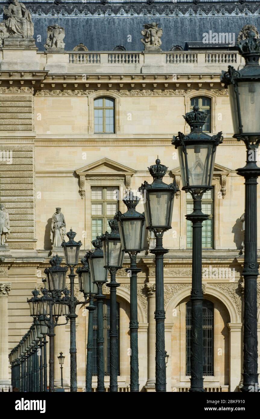 Row of lamps, Architectural details and statues on the Louvre Museum ...