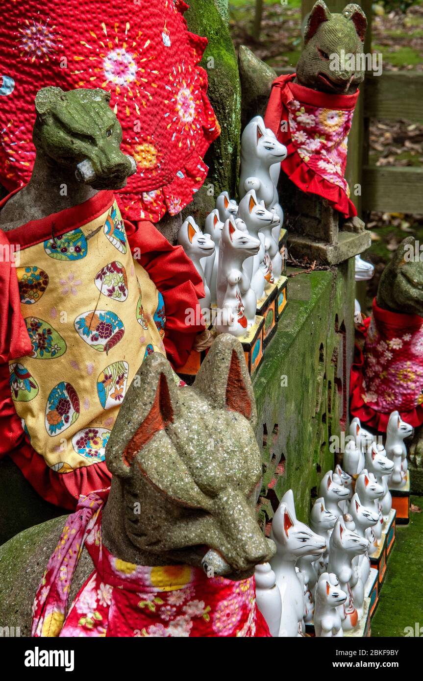 Kitsune fox deities, Kashima Jingu forest, Kashima, Japan. Inari is the ...