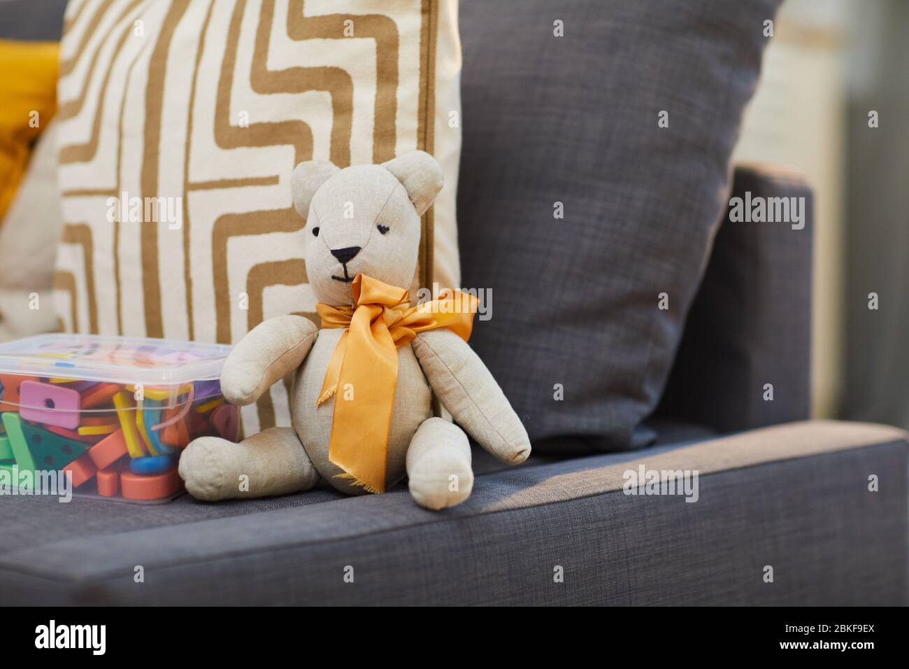 Cute teddy bear stuffed toy with yellow satin ribbon around its neck ...