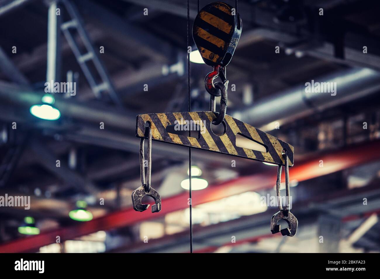 Crane chain and hook with blurred warehouse background. Concept ...