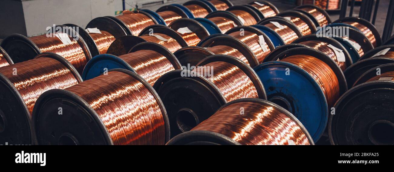 Production of copper wire, bronze cable in reels at factory Stock Photo ...