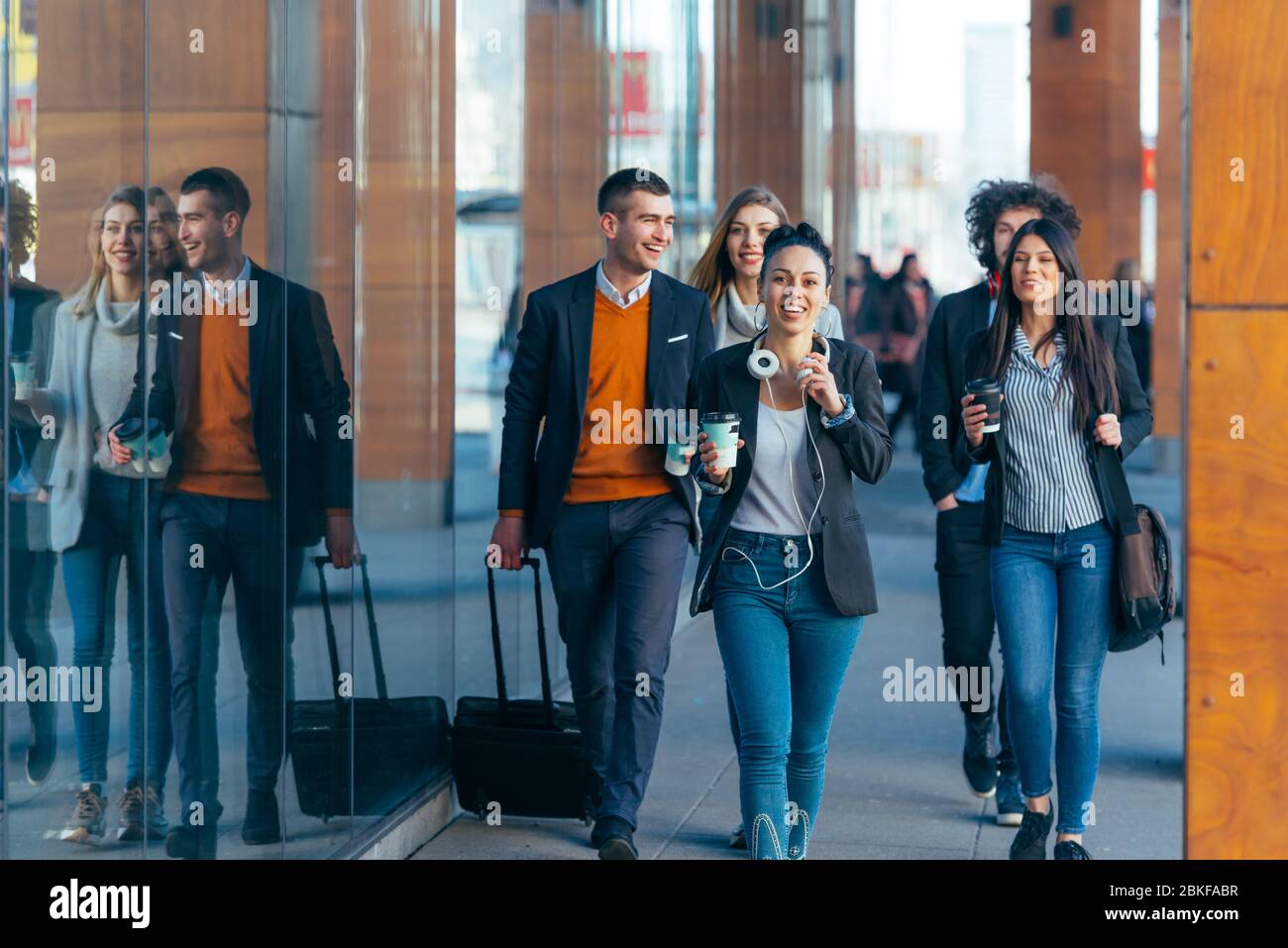 Group of colleagues on a business trip (euro trip) walking together at ...